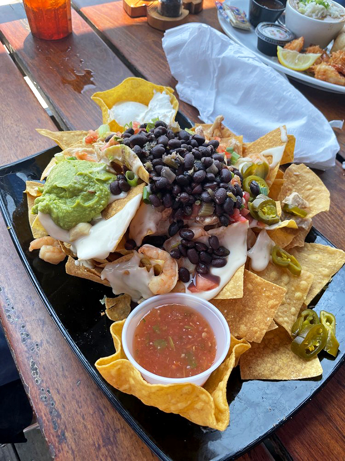 These nachos aren't messing around&mdash;loaded with black beans, queso, and seafood in quantities that suggest the chef might actually like you.