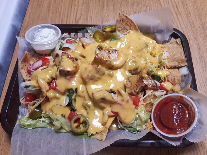 Nachos that require a strategy meeting before eating&mdash;where every chip is a treasure map leading to the perfect combination of cheese, jalape&ntilde;os, and grilled chicken.