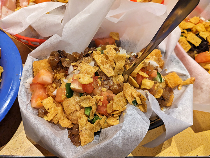 Frito pie meets nacho extravaganza in this basket of crunchy, savory goodness that whispers, "Diet? What diet?" with every delicious bite.