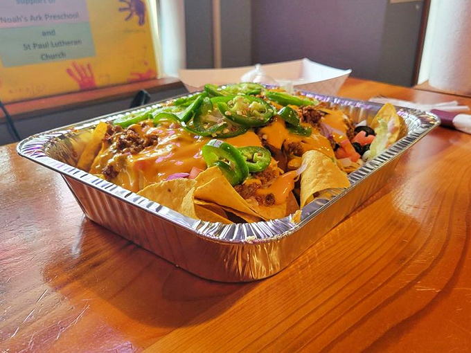 These loaded nachos aren't just a dish, they're an architectural achievement of cheese, jalape&ntilde;os, and happiness stacked in perfect harmony.