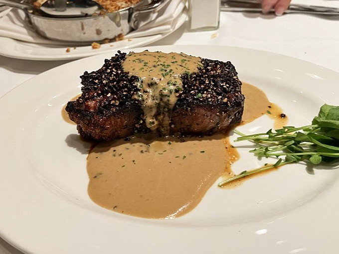 The peppercorn crust and sauce create a flavor symphony. Like a perfectly tailored suit, this steak makes an impression that lasts.