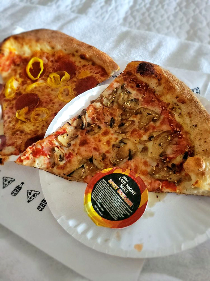 Two slices, infinite possibilities. The mushroom and pepperoni offerings demonstrate why folding your slice is both practical and reverential.