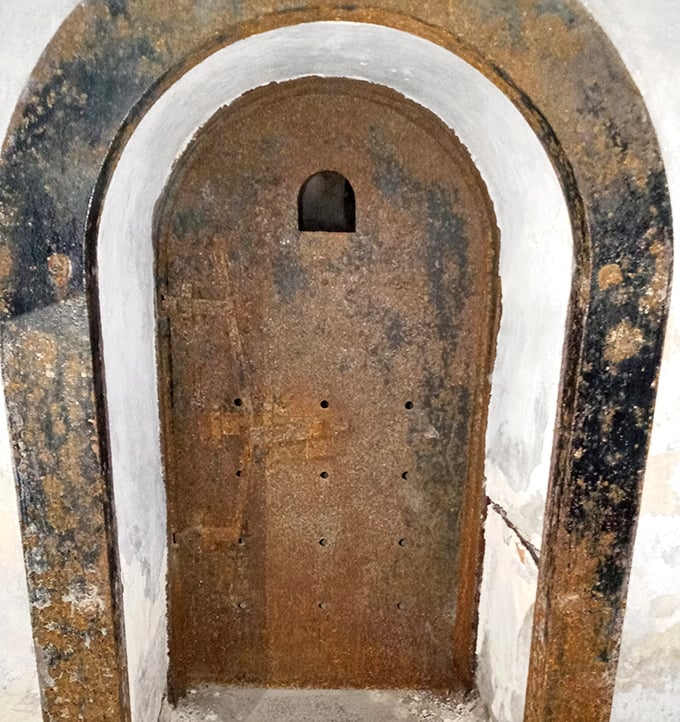 This cell door has seen more drama than a lifetime of soap operas, with a peephole that offered the only glimpse of the outside world.