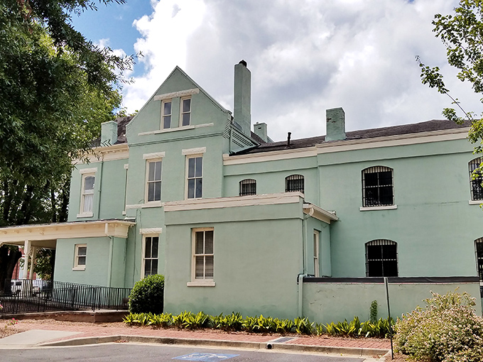 The mint-green Old Jail Museum might look charming now, but those barred windows remind us that time-outs were a bit more serious back then.