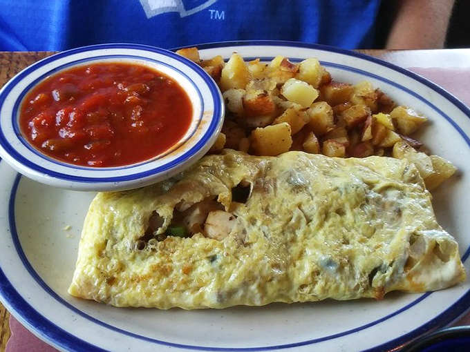 An omelet that doesn't just contain ingredients&mdash;it celebrates them, with home fries playing the perfect supporting role.