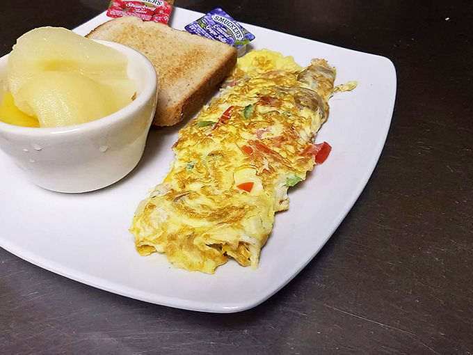 This omelet didn't just happen&mdash;it was engineered by someone who understands that breakfast is the most important art form of the day. Note the perfect fold technique!