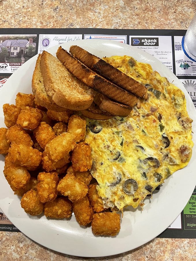 The omelet that launched a thousand road trips. Those crispy hash browns aren't just a side dish&mdash;they're the supporting actor who steals the show.