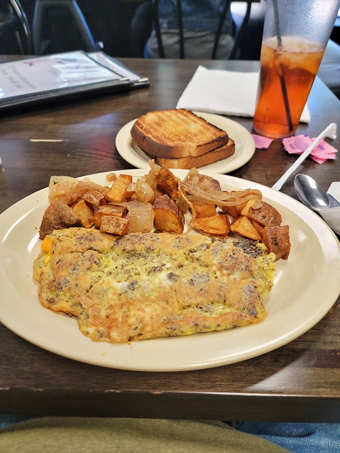 This isn't just an omelet&mdash;it's a morning masterpiece with home fries that could make a potato proud. Breakfast alchemy at its finest.