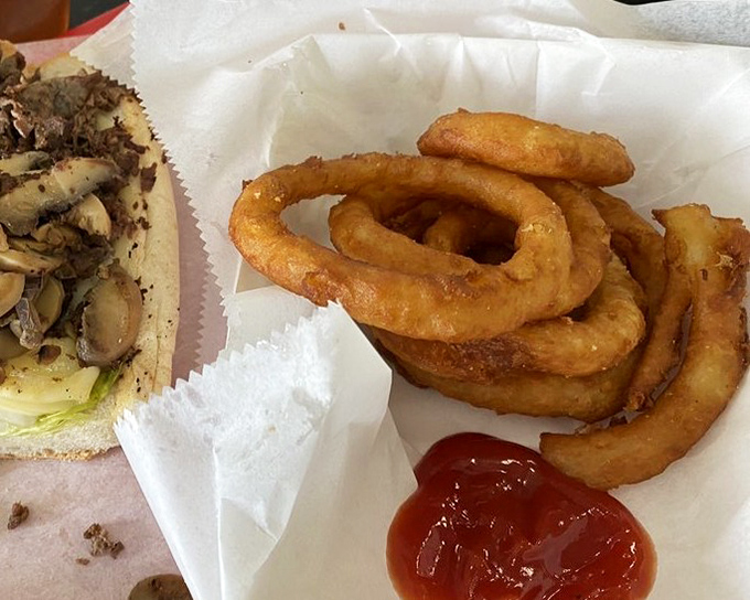 Golden onion rings with that perfect crunch factor &ndash; the supporting actor that sometimes steals the show from the cheesesteak star.v