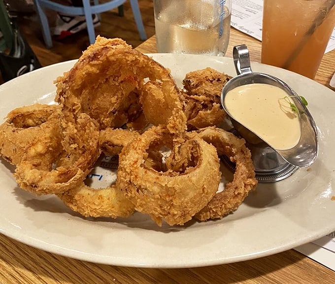 These aren't just onion rings; they're golden halos of crispy perfection that make you wonder why you ever wasted time on lesser appetizers.