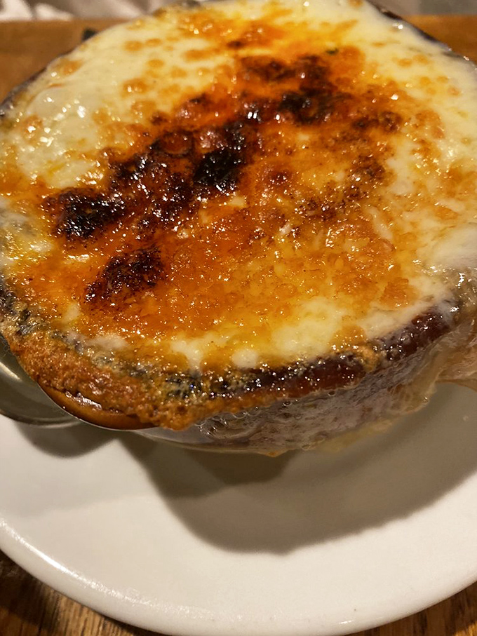 Cheese that stretches toward heaven&mdash;the onion soup here isn't just served, it's performed. That golden, bubbling crust is basically the Broadway finale of comfort food.