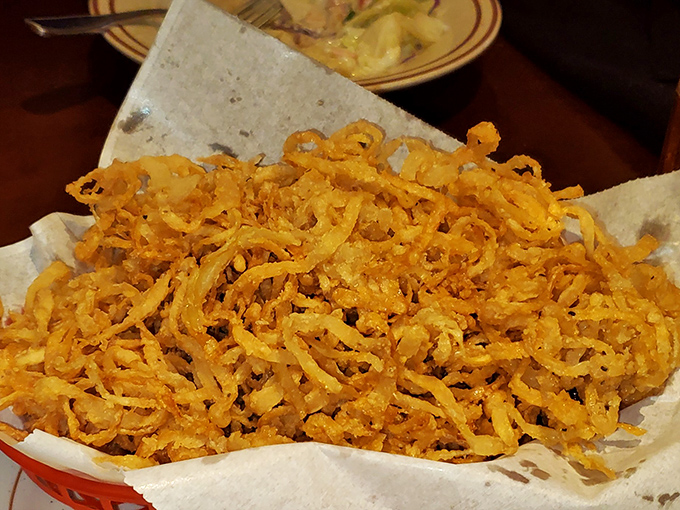These onion straws aren't just a side dish &ndash; they're crispy, golden tangles of happiness that'll make you forget potato chips ever existed.