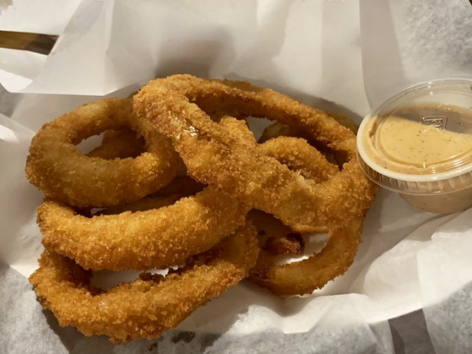Golden halos of happiness. These onion rings aren't just side dishes; they're the supporting actors that deserve their own Oscar.