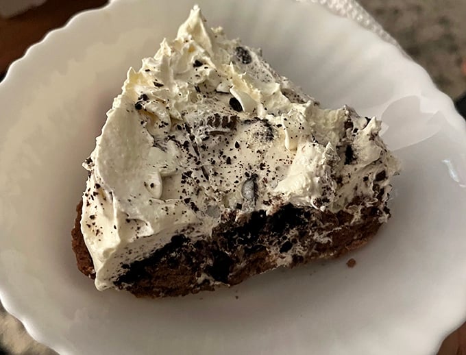 This isn't just Oreo pie &ndash; it's a cloud of creamy nostalgia topped with cookie dust that would make your childhood self high-five your adult self.