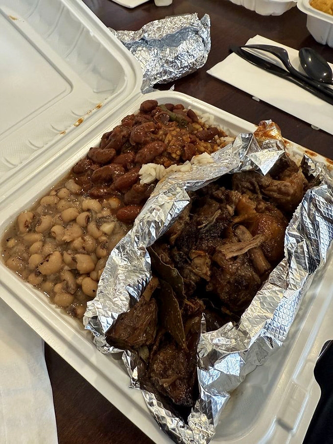 Oxtails so tender they practically surrender at the sight of your fork. Paired with those beans, it's a masterclass in soulful cooking.