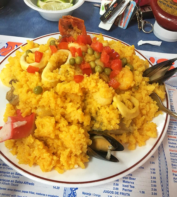 Yellow rice studded with seafood jewels and bright vegetables. This paella doesn't just feed your hunger; it feeds your soul with Caribbean sunshine.