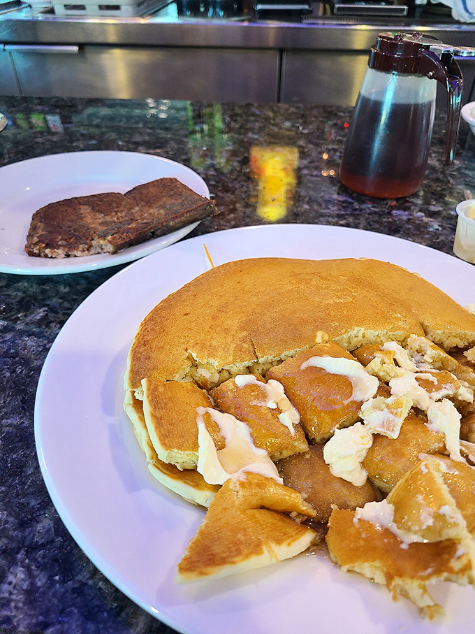 These pancakes arrive looking like fluffy clouds that somehow learned how to taste like heaven on earth.