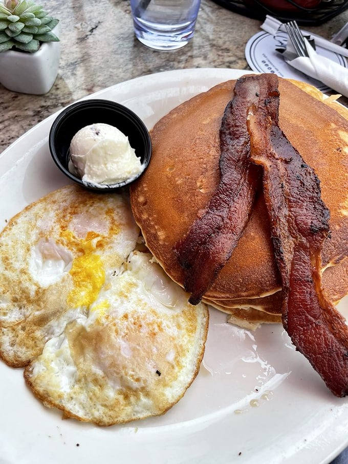 The pancake-egg-bacon trinity that proves sometimes the classics don't need reinvention&mdash;just perfect execution and a side of butter.