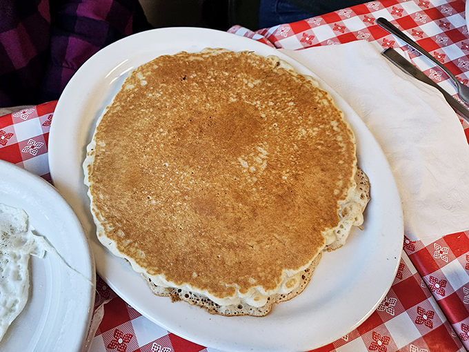 Pancakes at Angie's achieve that mythical balance: golden-brown exterior giving way to a fluffy interior that absorbs syrup like it was designed by NASA.