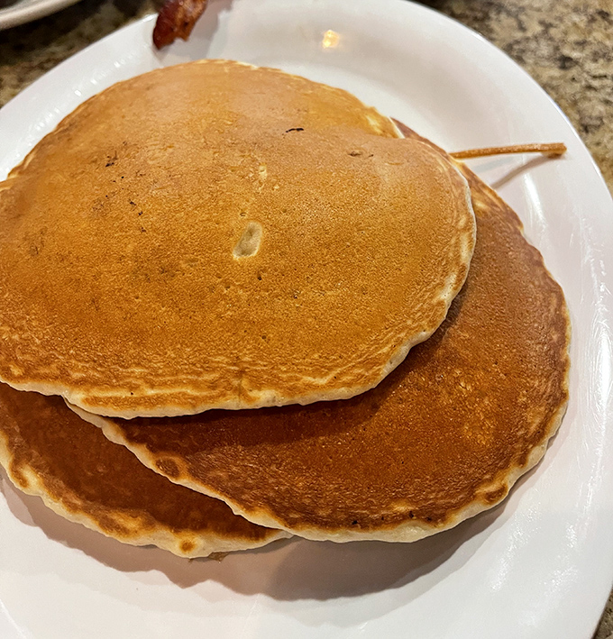 Pancakes so perfectly golden and fluffy they could moonlight as pillows. These breakfast frisbees demand respect &ndash; and real maple syrup.