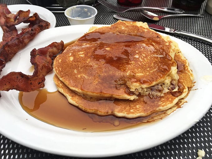 Pancakes so perfectly golden they belong in Fort Knox, paired with bacon that's achieved that magical balance between crispy and chewy. Breakfast nirvana, served daily.