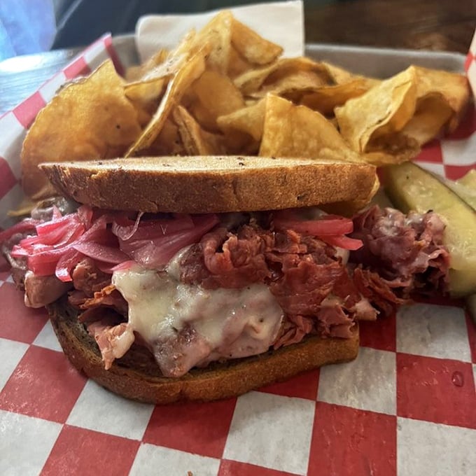 Pastrami poetry on rye with house-made chips. That pink-hued mountain of meat isn't just a sandwich&mdash;it's architecture you can eat.