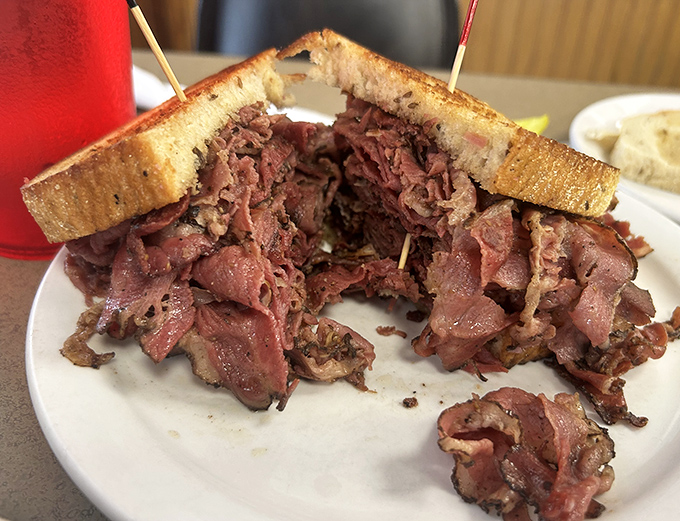 When your sandwich requires structural engineering and toothpicks for support, you know you've found a place that understands proper portion size.