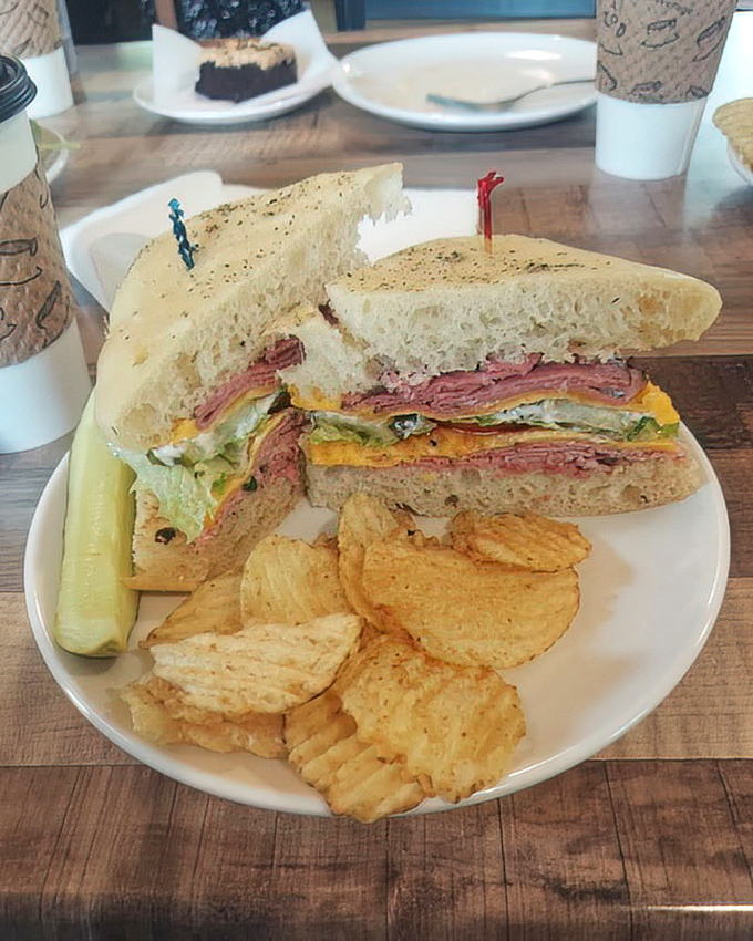 The sandwich that launched a thousand road trips. Stacked higher than your weekend reading pile, with chips that crunch like autumn leaves.