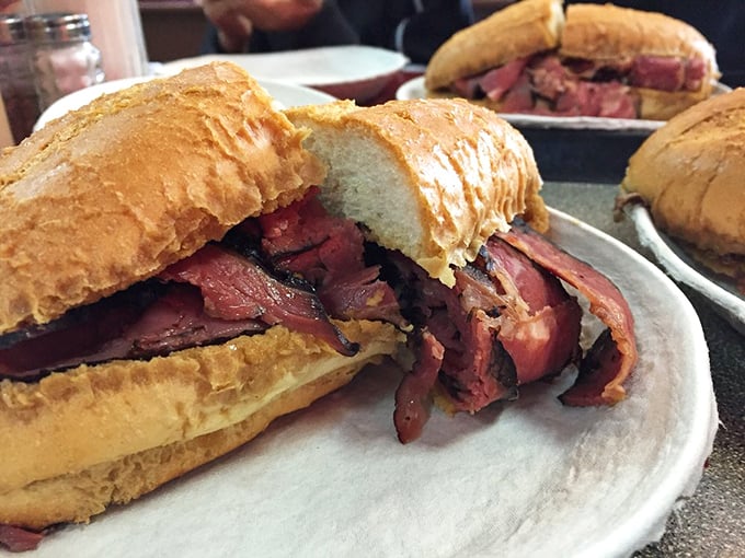 Pastrami piled high between golden bread – not a sandwich for the faint of heart or those with tiny appetites.