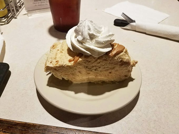 Peanut butter pie with a cloud of whipped cream&mdash;proof that sometimes the simplest desserts create the most profound moments of silence at the table.