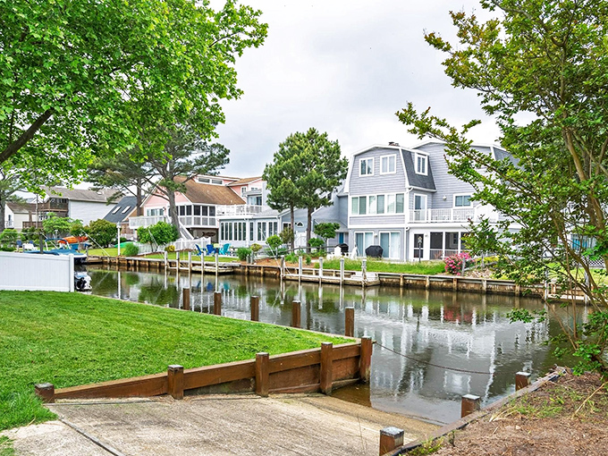 These canals aren't just pretty – they're the community's liquid streets, where homes turn their best faces to the water rather than the road.