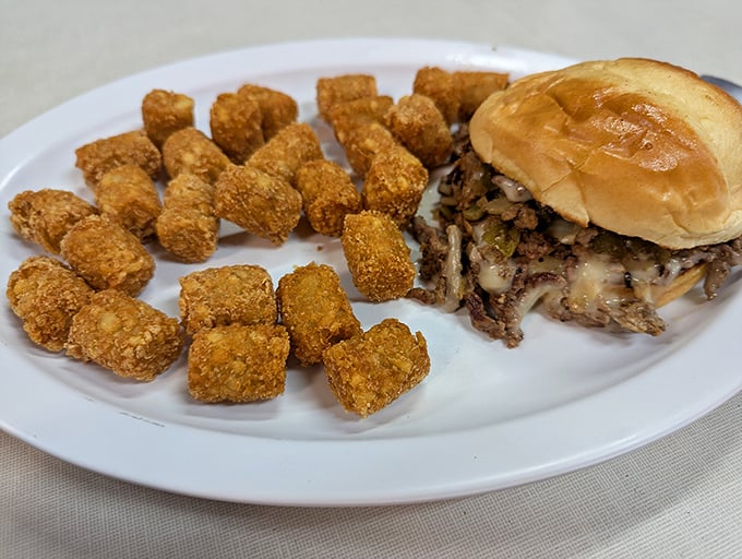 Tater tots and a sandwich that would make Philadelphia jealous. Comfort food doesn't need to apologize for being exactly what you crave.
