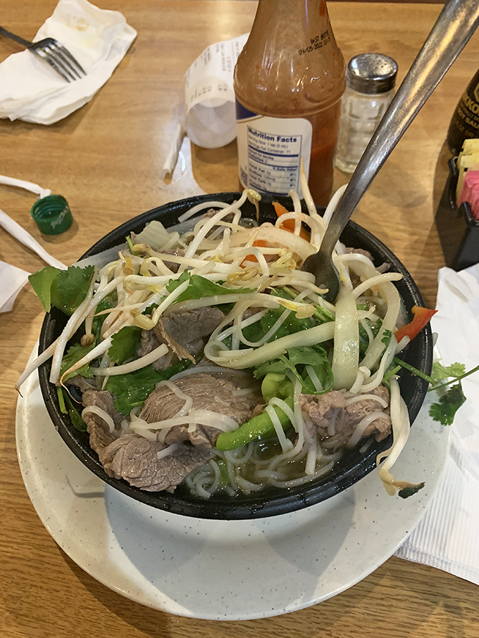 This steaming bowl of pho delivers a fragrant symphony of broth, noodles, and tender beef that could warm even the coldest Maryland winter day.