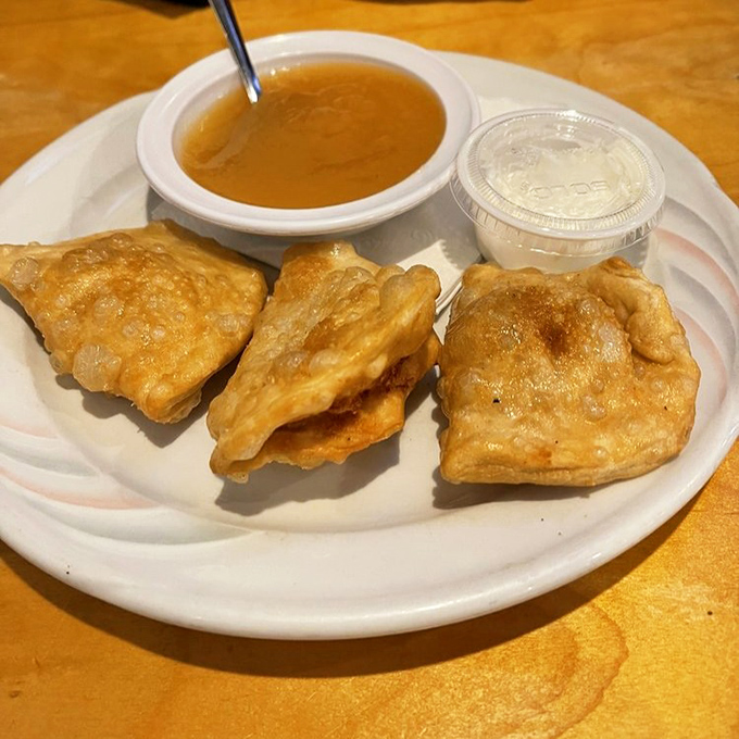 These golden-fried pierogies aren't just food; they're Cleveland's soul on a plate, ready for their dip in that savory broth.