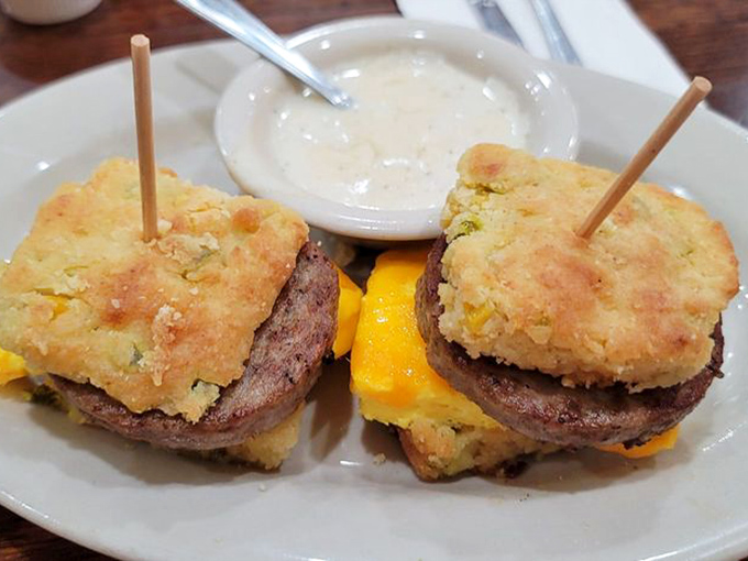 Breakfast sandwiches that require engineering degrees to eat. Layers of sausage, egg, and cheese nestled between golden biscuits&mdash;morning architecture at its finest.