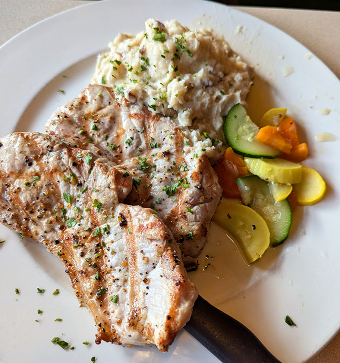 These pork chops don't need a social media manager &ndash; they sell themselves with juicy perfection and classic sides that haven't changed because they've never needed to.