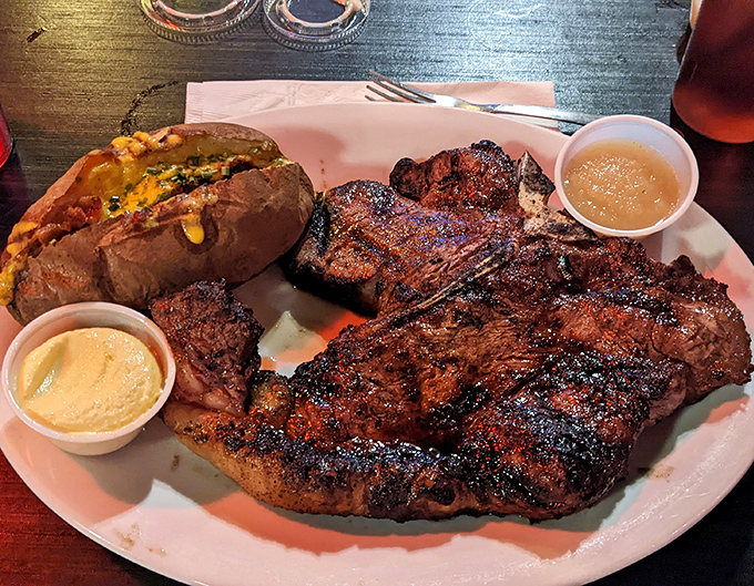 This porterhouse doesn't just occupy the plate&mdash;it commands it, with a loaded baked potato standing guard like a delicious sentinel.