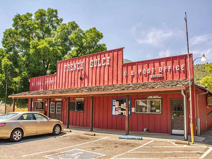 The bright red French Gulch Post Office doubles as the town's social hub. Mail delivery here isn't just a service &ndash; it's a daily community event.