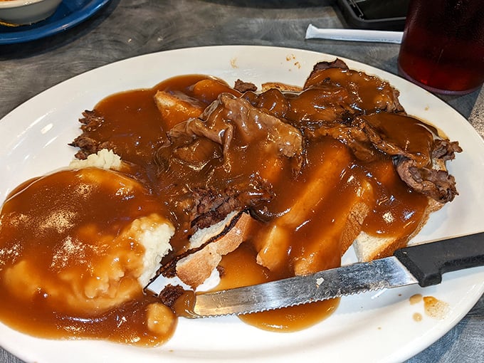 This isn't just pot roast&mdash;it's a gravy tsunami over tender beef and mashed potatoes. The kind of open-faced sandwich that demands both a fork and your undivided attention.