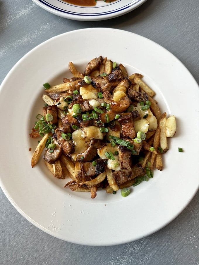 The pork belly and potato combo delivers the kind of flavor that makes you momentarily forget your cholesterol numbers. Green onions add that crucial fresh contrast.