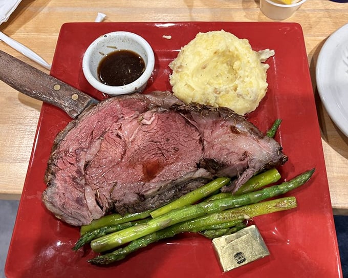 Prime rib that's perfectly pink in the middle with a seasoned crust that should be illegal. The asparagus is just showing off.