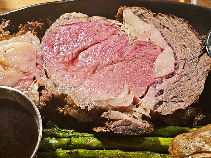 This prime rib isn't just pink in the middle—it's blushing with pride. The kind of meat that makes vegetarians question their life choices.