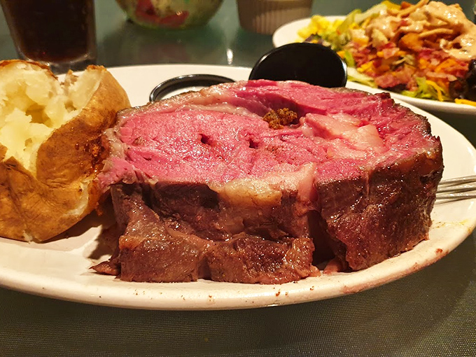 Prime rib so perfectly pink it makes you wonder if you've ever truly experienced beef before. That baked potato stands by like a loyal sidekick.