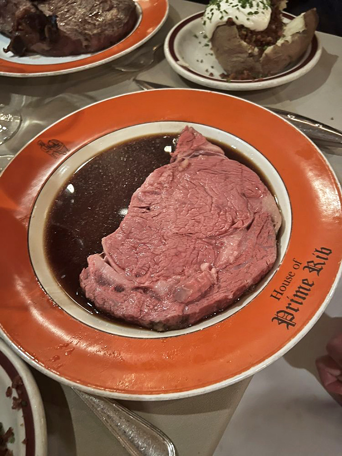 Each slice reveals a perfect pink interior that practically glistens under the dining room lights &ndash; tender enough to cut with a fork, juicy enough to make you close your eyes in appreciation.