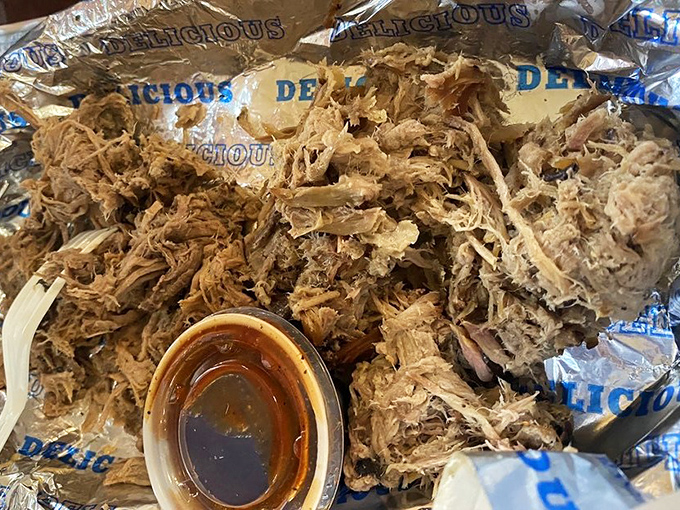 A mountain of pulled brisket with a side of sauce that should be illegal in at least nine states. Resistance is futile.