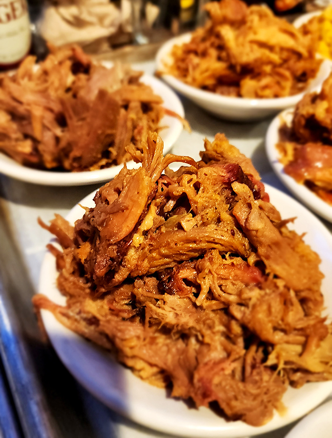 Pulled pork so tender it practically surrenders at the sight of your fork. Each strand carries the perfect balance of smoke, spice, and that unmistakable slow-cooked love.