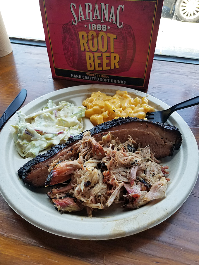 A plate that tells the whole story: pulled pork with perfect texture, brisket with that signature bark, and sides that refuse to be overshadowed.