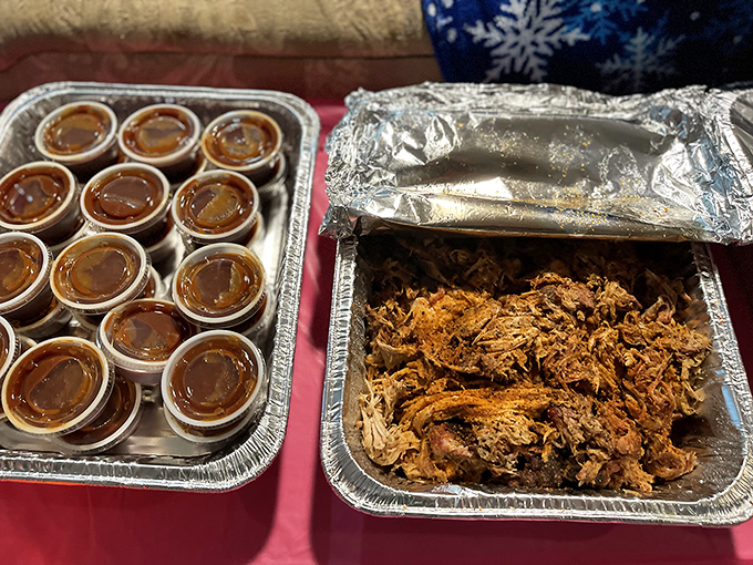 Pulled pork and sauce cups ready for their close-up. This isn't just food&mdash;it's a family-style feast waiting to happen.
