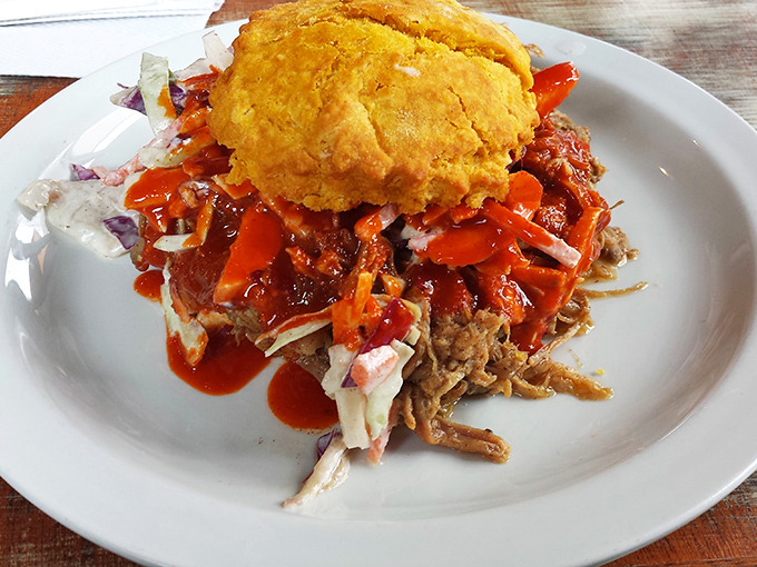 This pulled pork biscuit isn't just a sandwich&mdash;it's an architectural marvel balancing sweet, savory, and spicy in perfect Southern harmony.