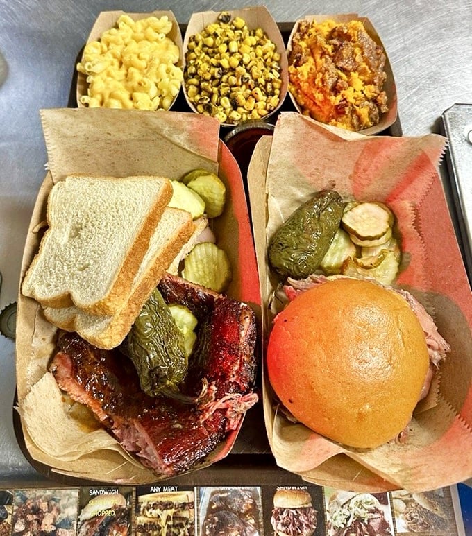 BBQ perfection doesn't require white tablecloths. This tray of sandwiches and sides proves that kraft paper and plastic baskets are the true vessels of culinary bliss.
